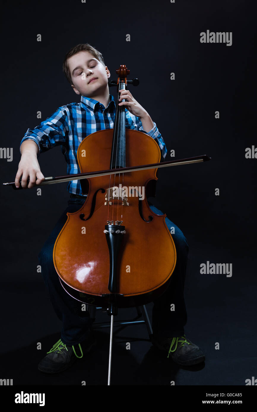 young Cellist playing classical music on cello Stock Photo - Alamy