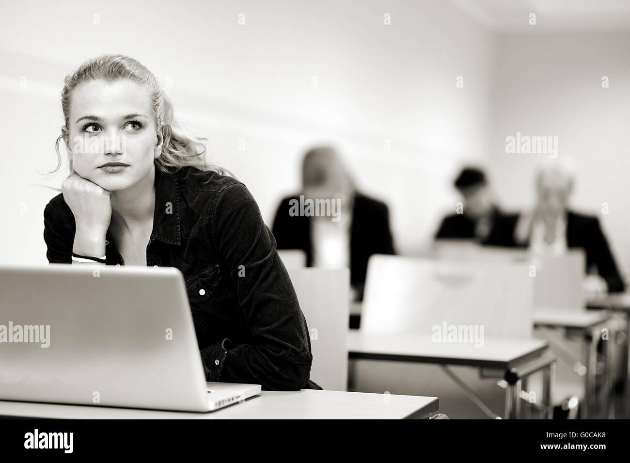 pretty female student in lecture hall Stock Photo - Alamy