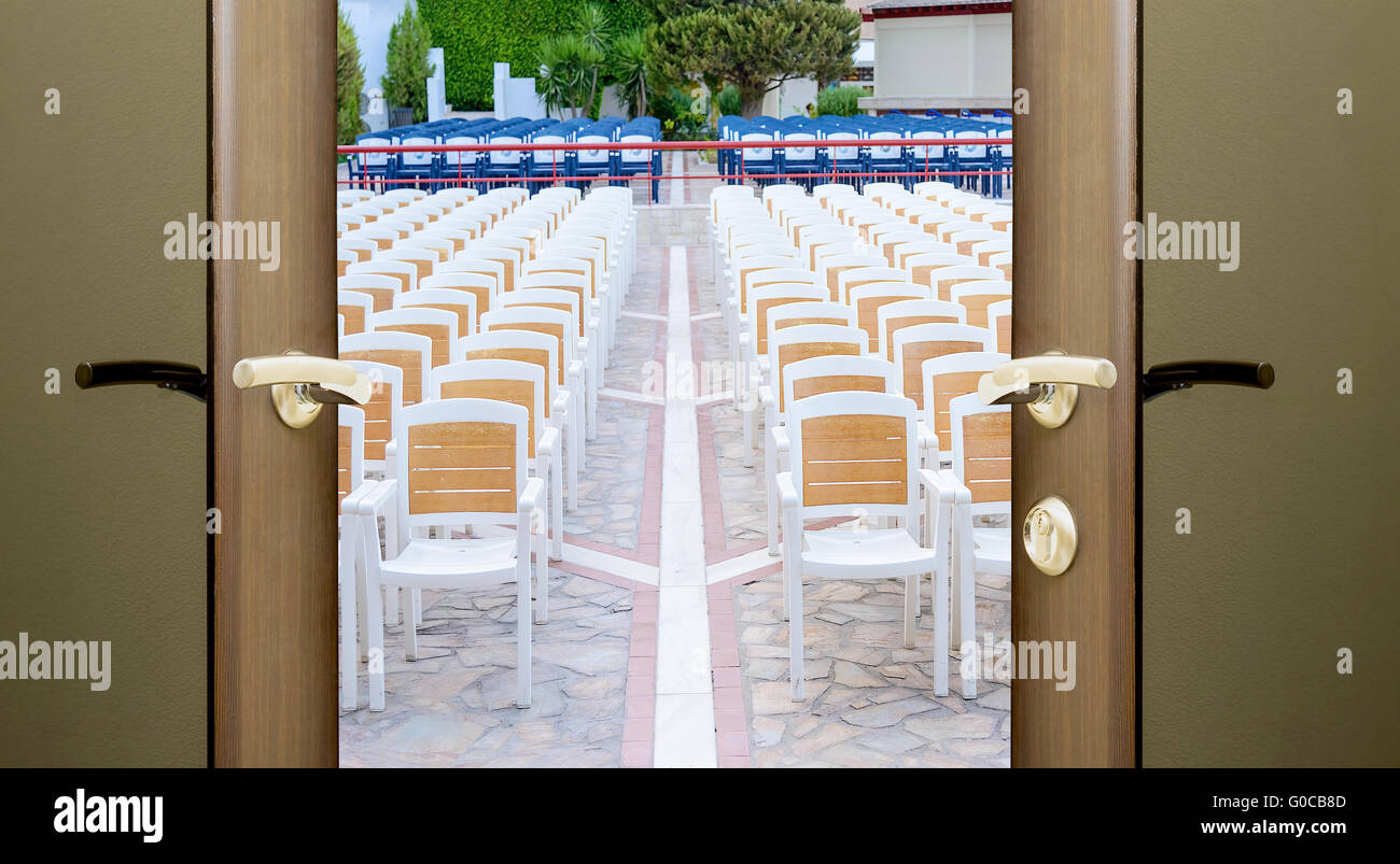 facing a number of seats in the concert hall in the open door Stock ...