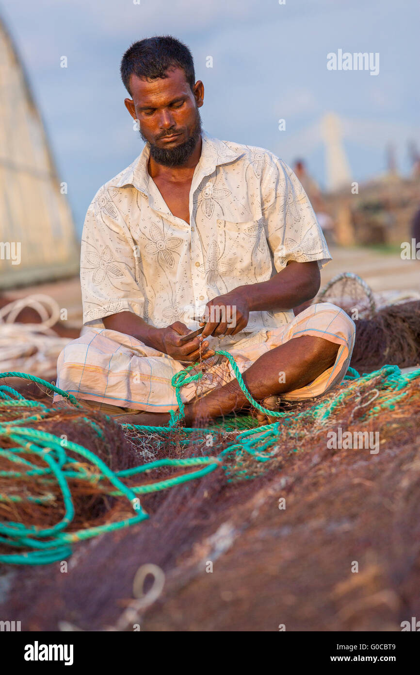 Fisherman repairing there big Hilsha-net Stock Photo - Alamy
