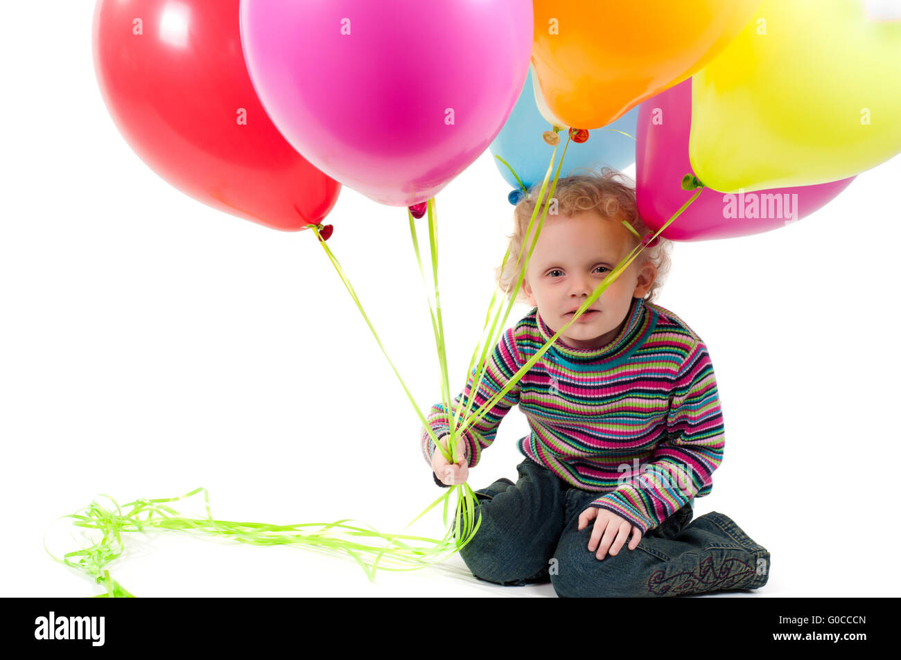 Little cute girl with multicolored air balloons Stock Photo - Alamy