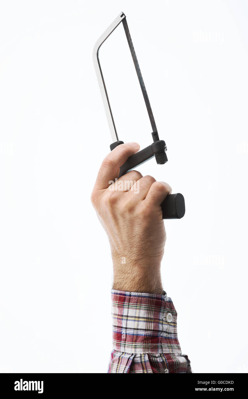 Male hand holding a small hacksaw on white background Stock Photo - Alamy