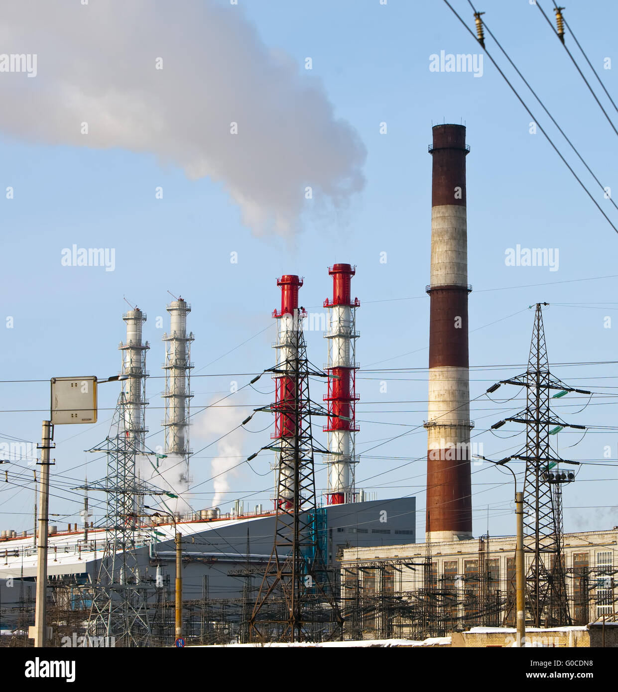 Pipe with smoke and line of electricity transmissi Stock Photo - Alamy