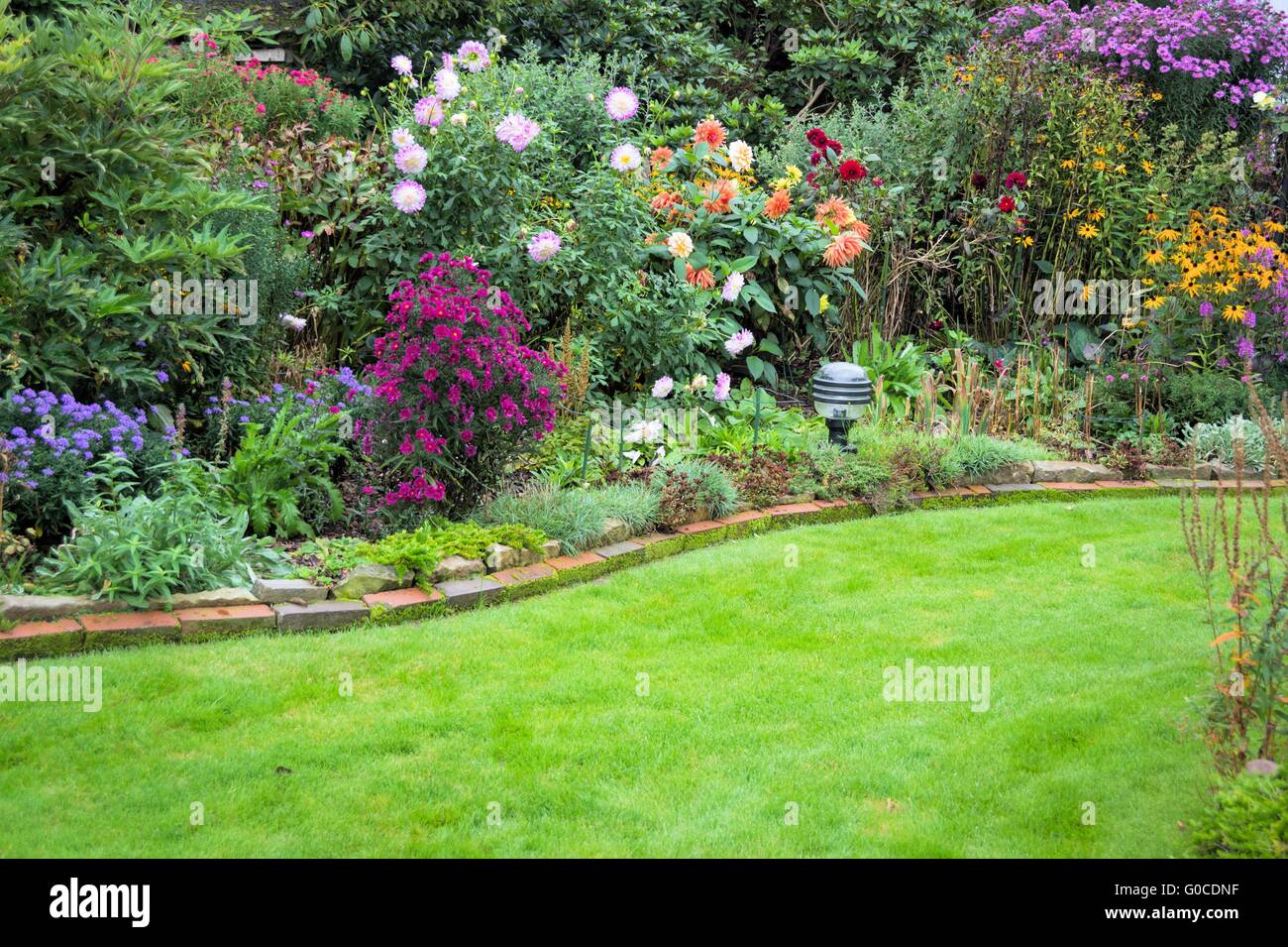 garden with lawn in september Stock Photo - Alamy