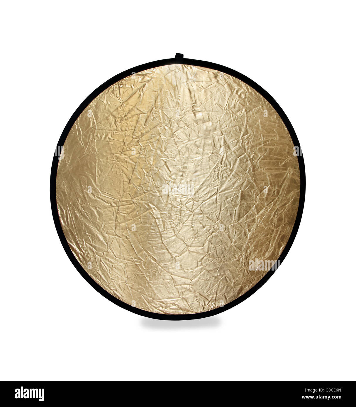 Isolated photo of a photography light reflector in gold Stock Photo - Alamy