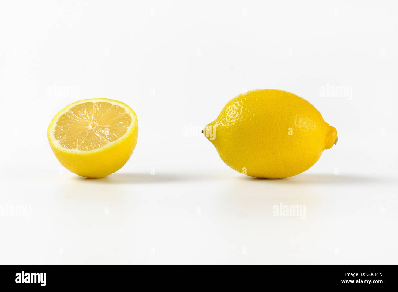 one and half fresh lemon on white background Stock Photo - Alamy