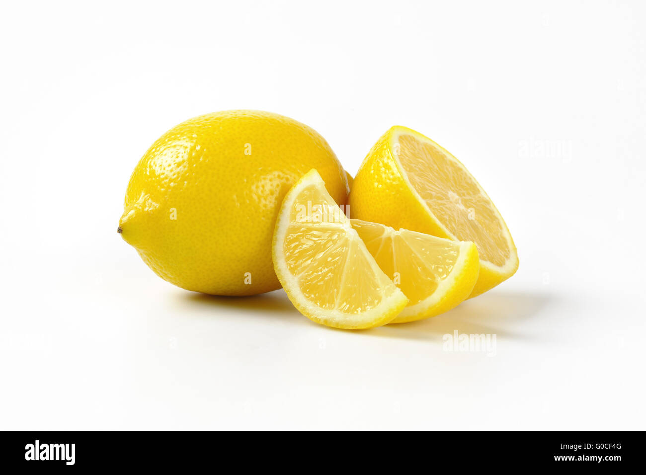 whole and sliced juicy lemons on white background Stock Photo - Alamy
