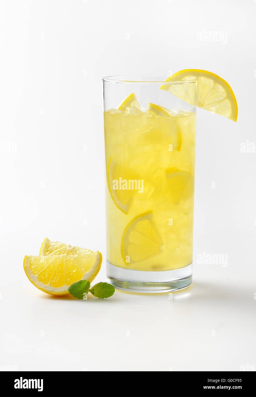 glass of fresh lemon juice with ice on white background Stock Photo - Alamy