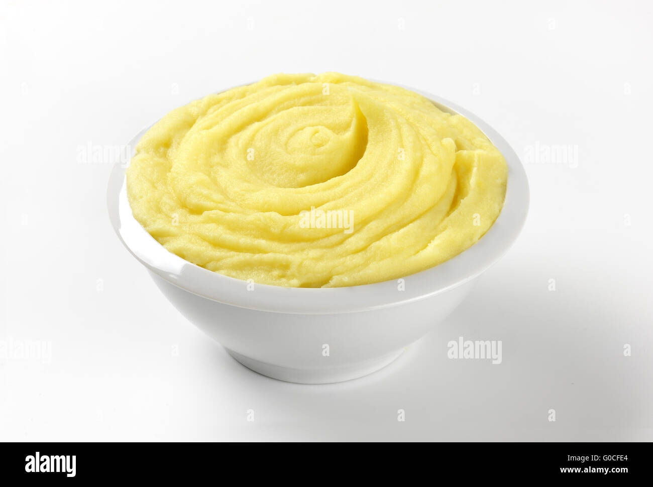 bowl of mashed potato puree on white background Stock Photo - Alamy