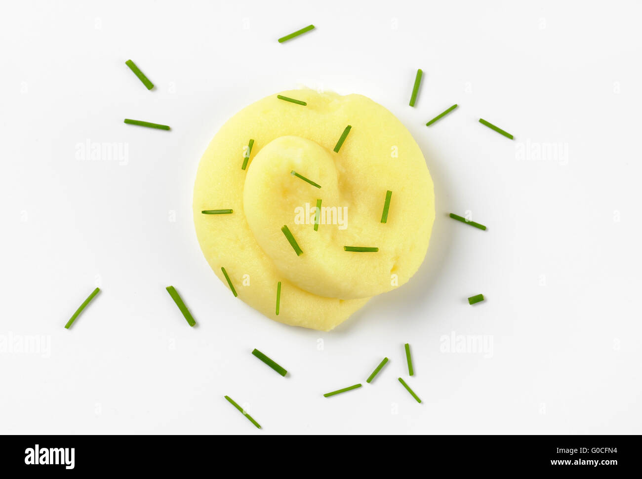 swirl of mashed potatoes with chives on white background Stock Photo ...