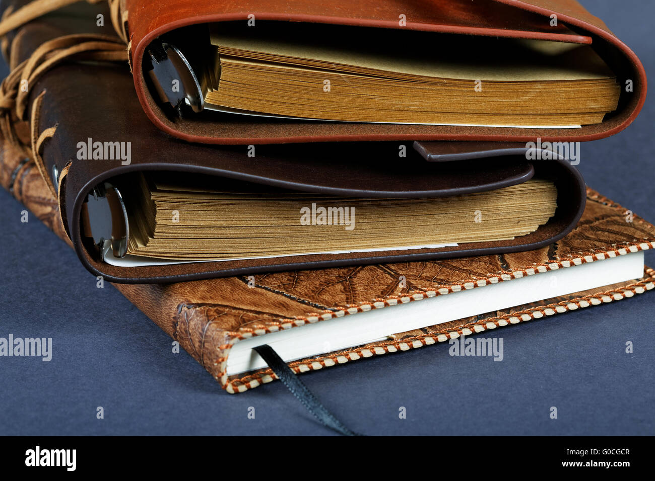 Pile of notebooks in leather covers close up Stock Photo - Alamy