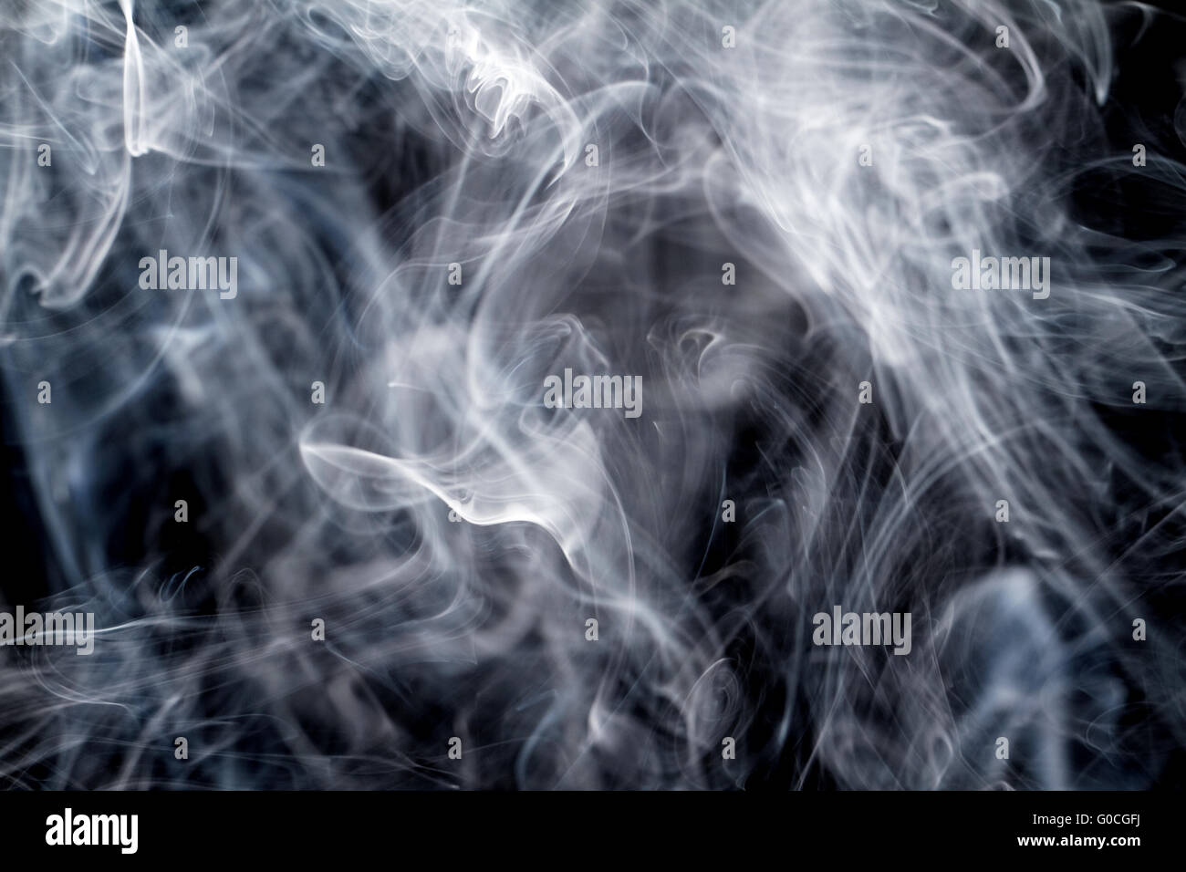Beautiful smoke on the black background - macro photo Stock Photo - Alamy