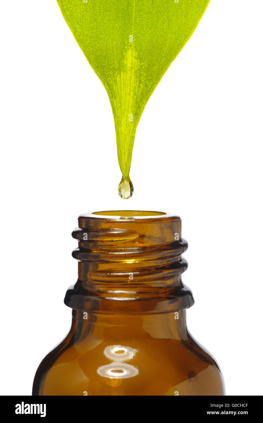 drop of medicinal plant falls into medical bottle Stock Photo - Alamy