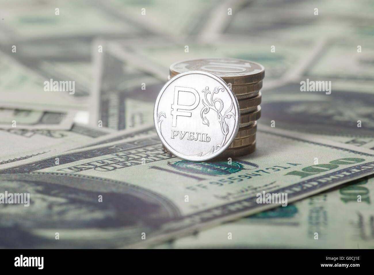 New russian ruble coin and american dollars Stock Photo - Alamy