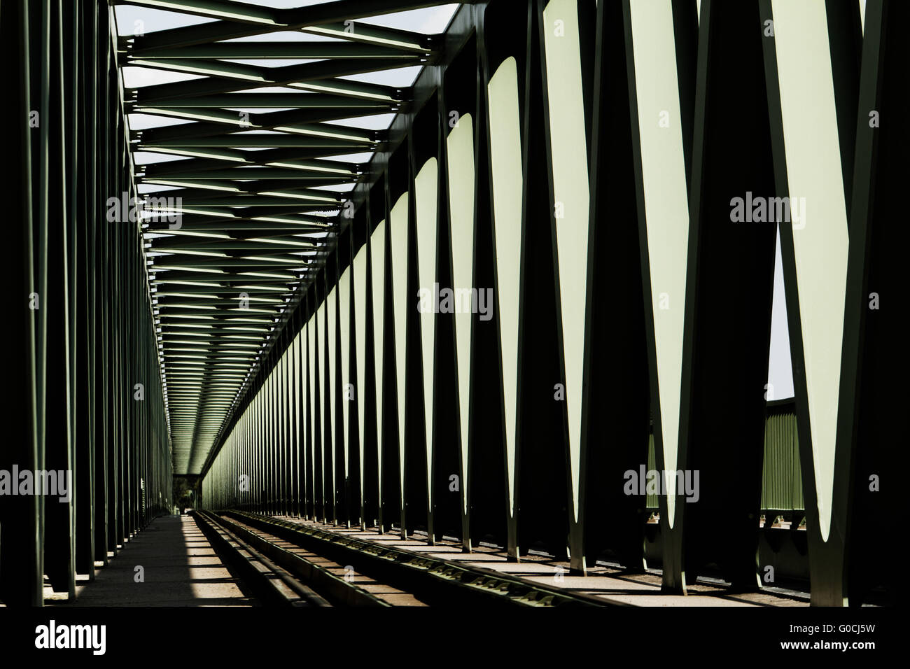Railway metal bridge perspective view Stock Photo - Alamy