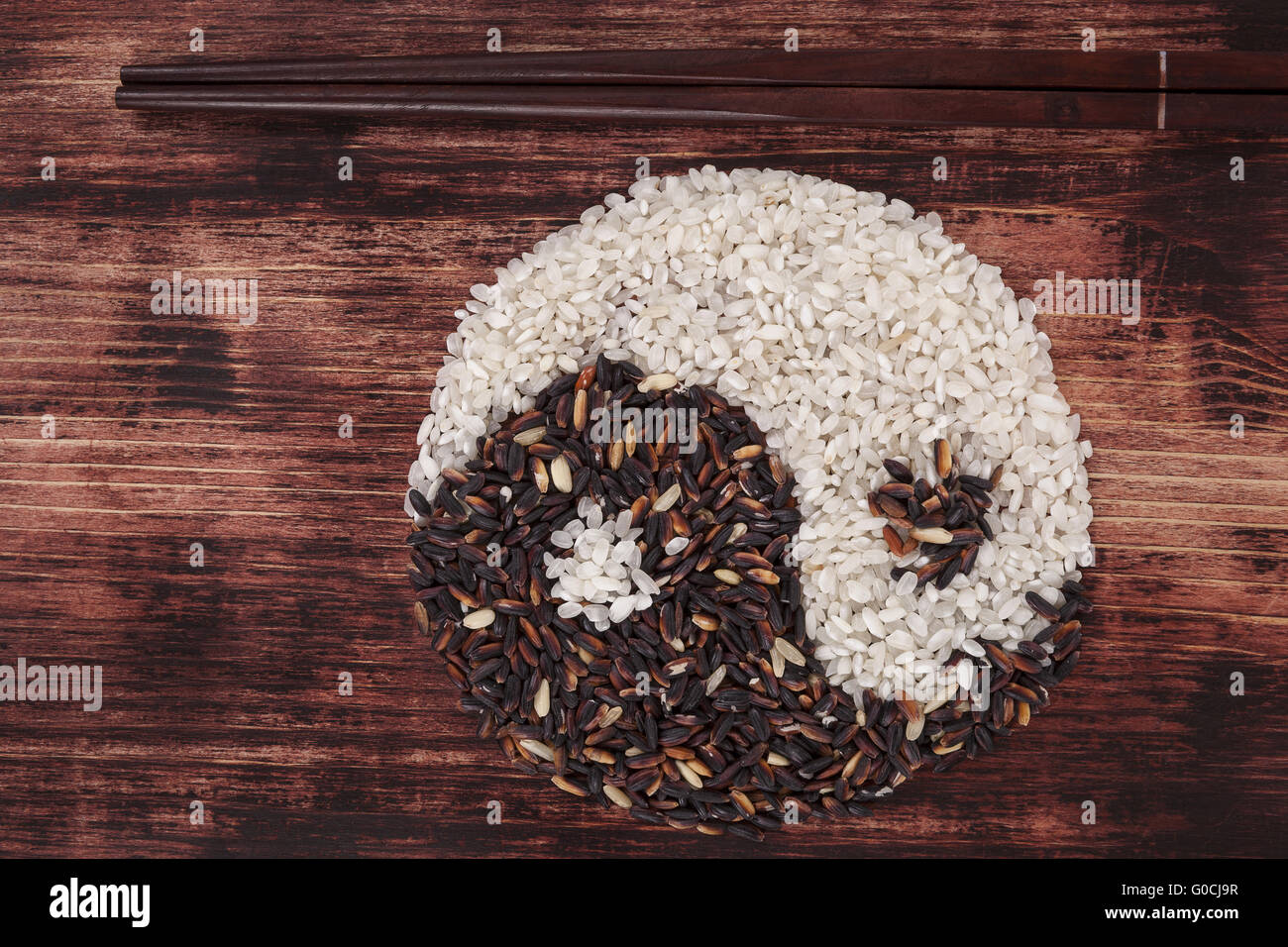 Black and white rice forming a yin yang symbol Stock Photo - Alamy