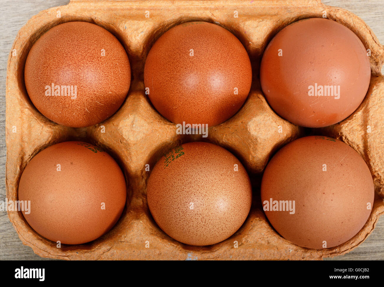 Six fresh brown eggs in a brown cardboard box, England, UK Stock Photo ...