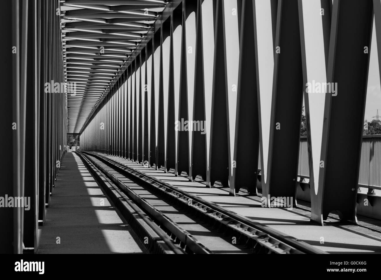 Railway metal bridge perspective view Stock Photo - Alamy