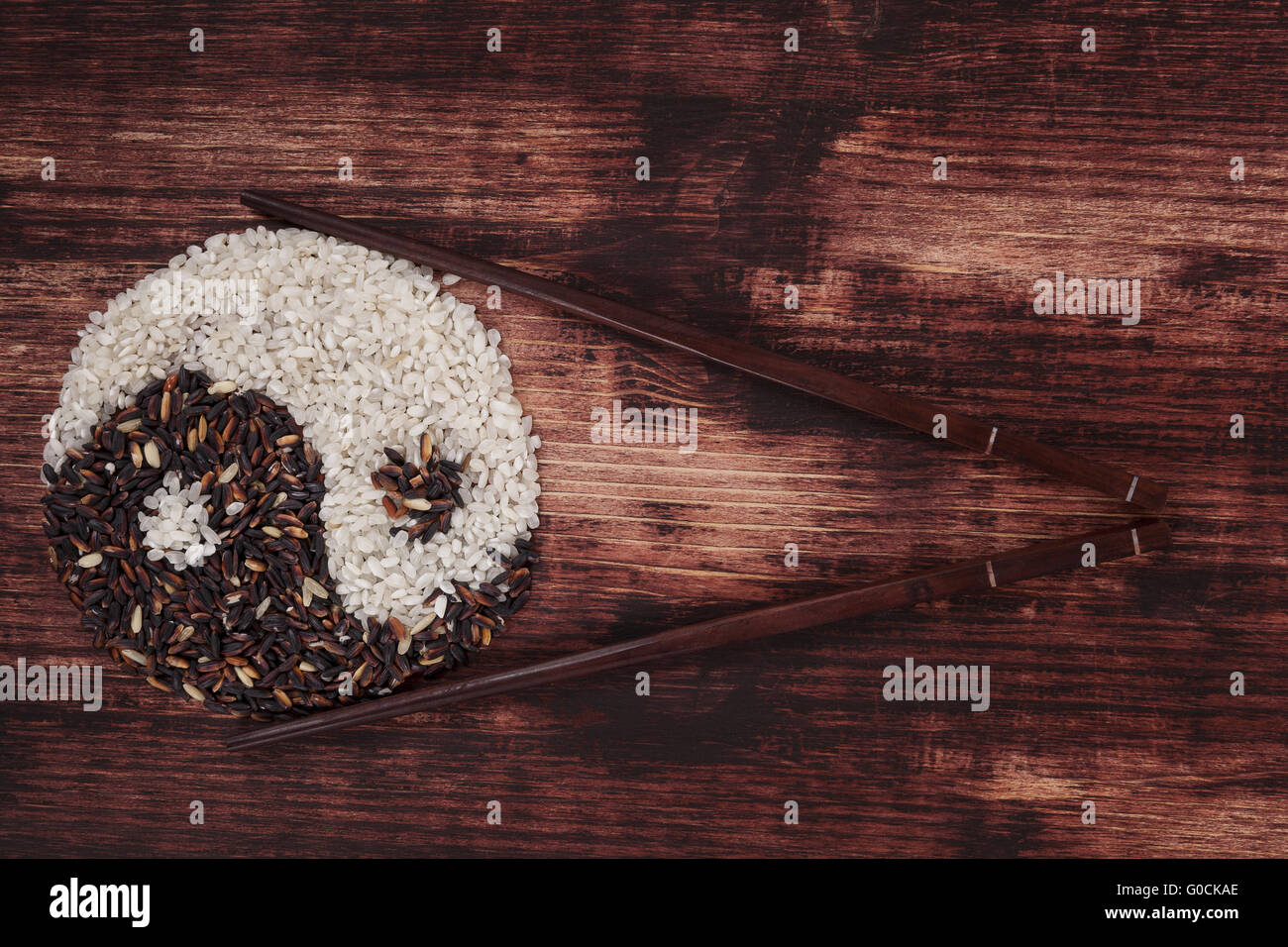 Black and white rice forming a yin yang symbol Stock Photo - Alamy