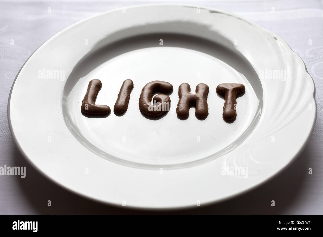 Letters forming the word light on a plate Stock Photo - Alamy