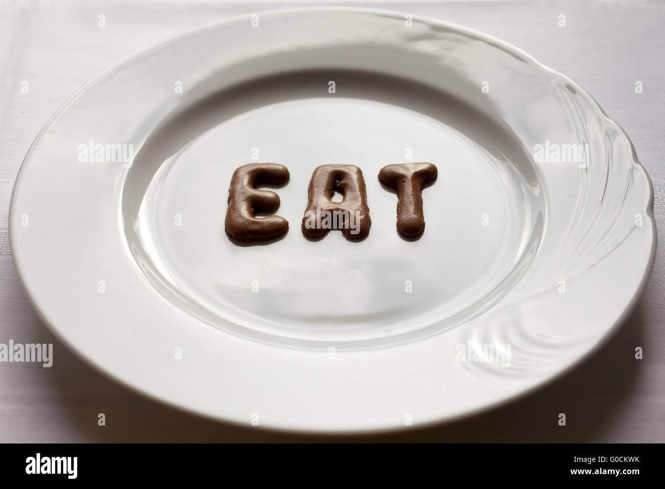 Letters forming the word eat on a plate Stock Photo - Alamy