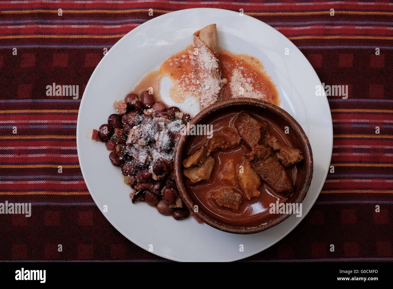 Traditional Estofado a stewed beef dish served with black beans and ...
