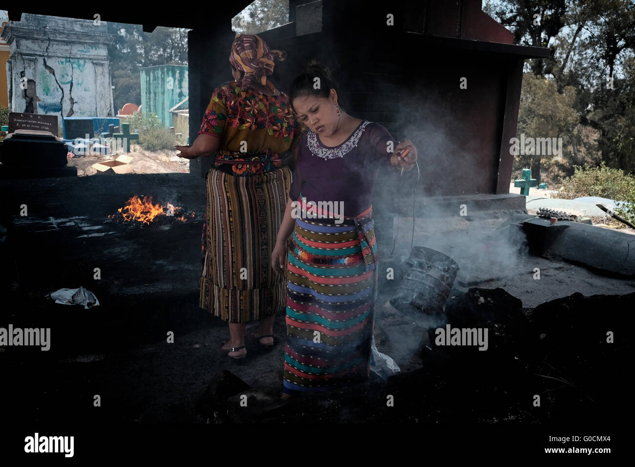 Local woman performs a traditional K'iche Maya ceremony using censers ...