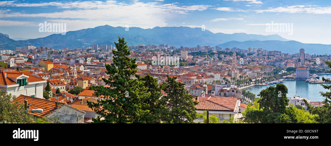 Split panoramic waterfront view of architecture and nature Stock Photo ...