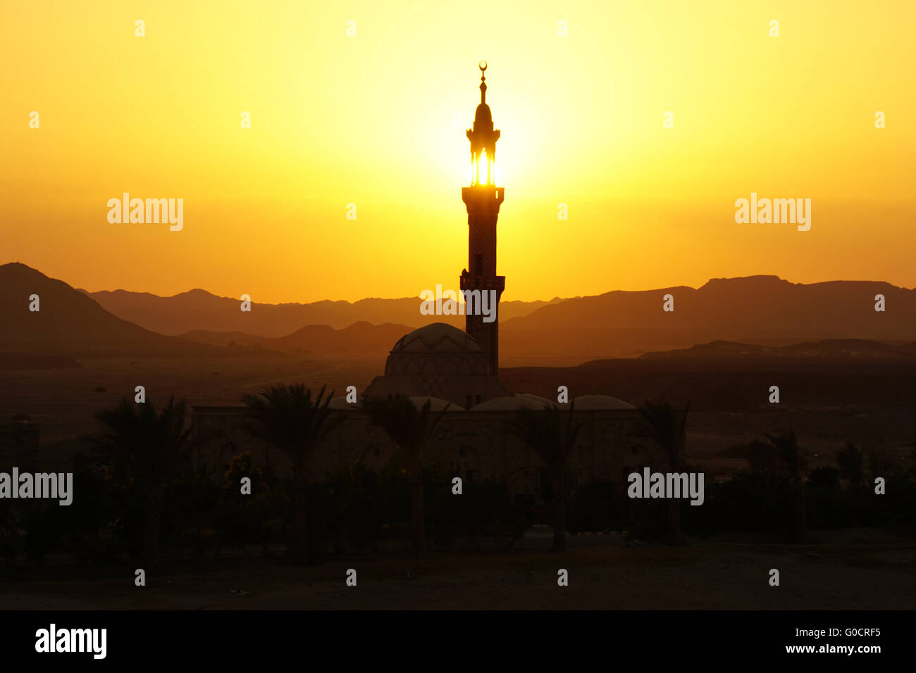 sunset over mosque in egypt town of el quesir Stock Photo - Alamy