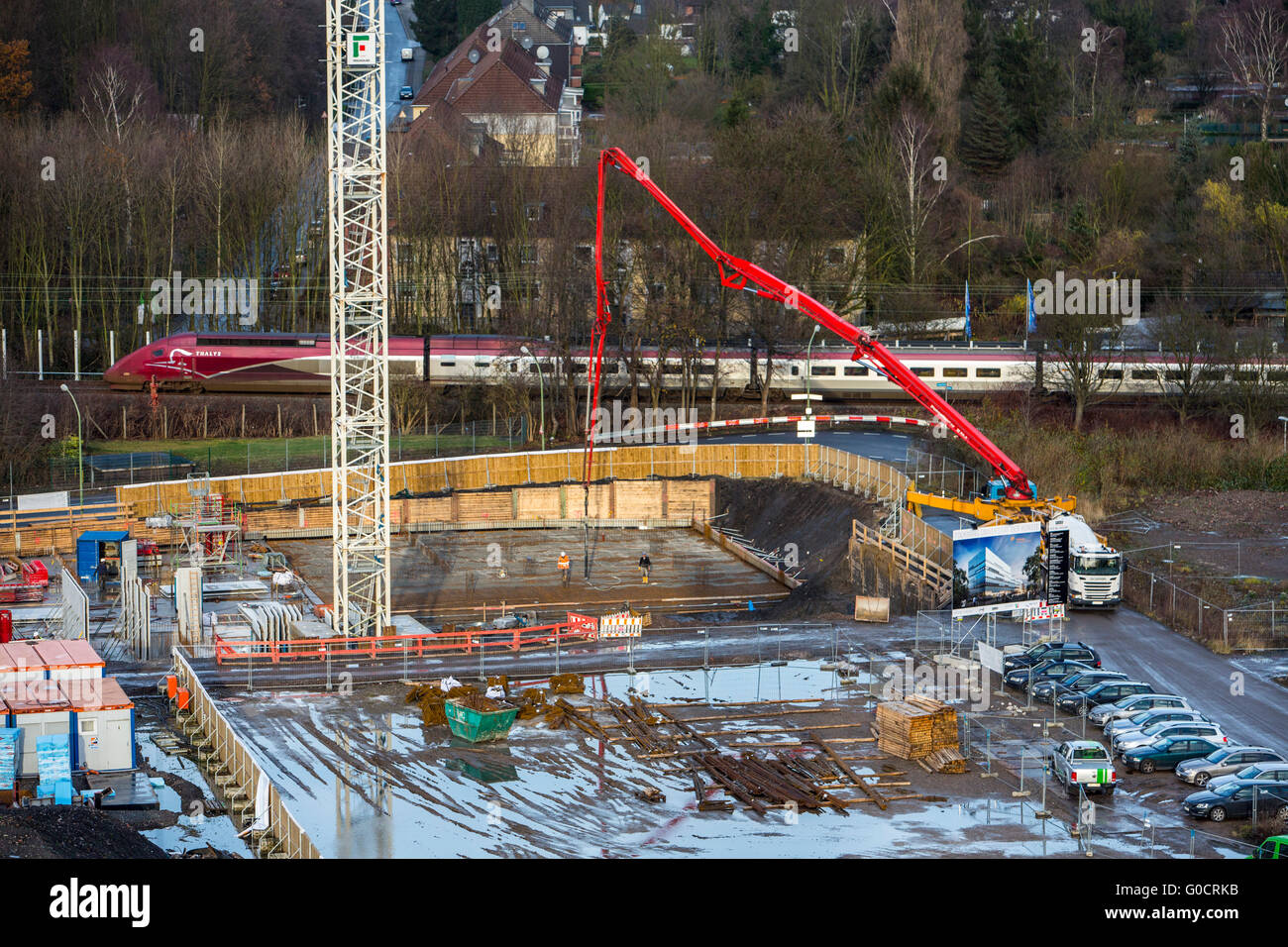 Construction, Concrete pump pumping concrete into the foundation of a ...