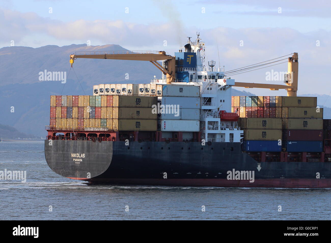 The container ship Nikolas, passing Cloch Point on the Firth of Clyde ...