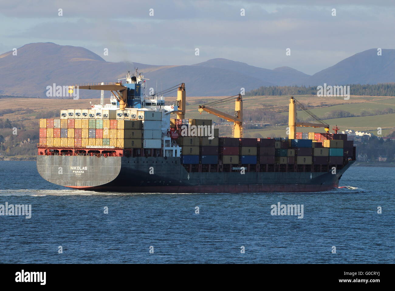 The container ship Nikolas, passing Cloch Point on the Firth of Clyde ...