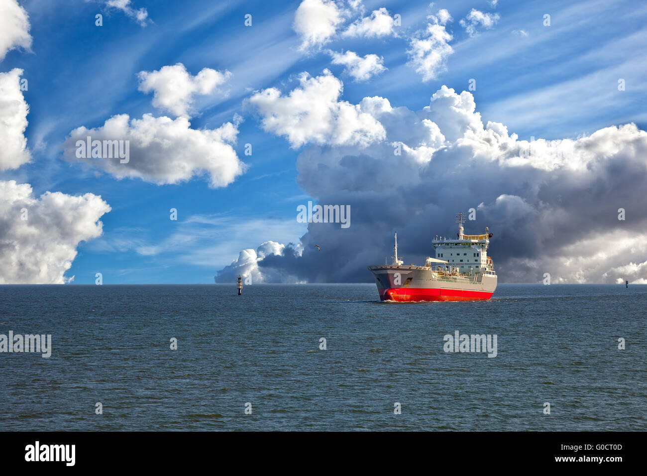 Oil tanker ship at sea on a background of blue sky Stock Photo - Alamy