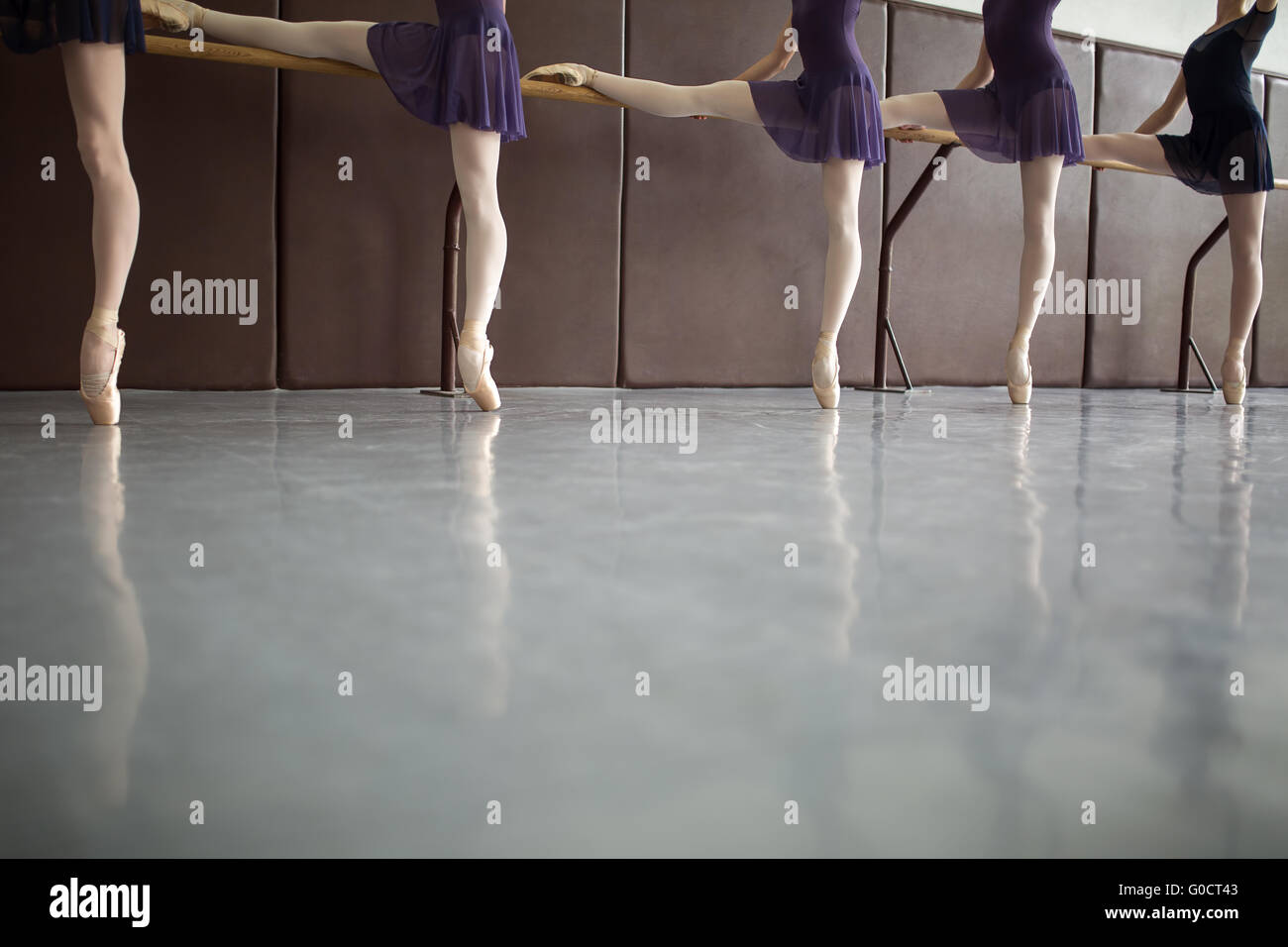 Five ballet dancers in class near the barre, legs only. Model we Stock ...