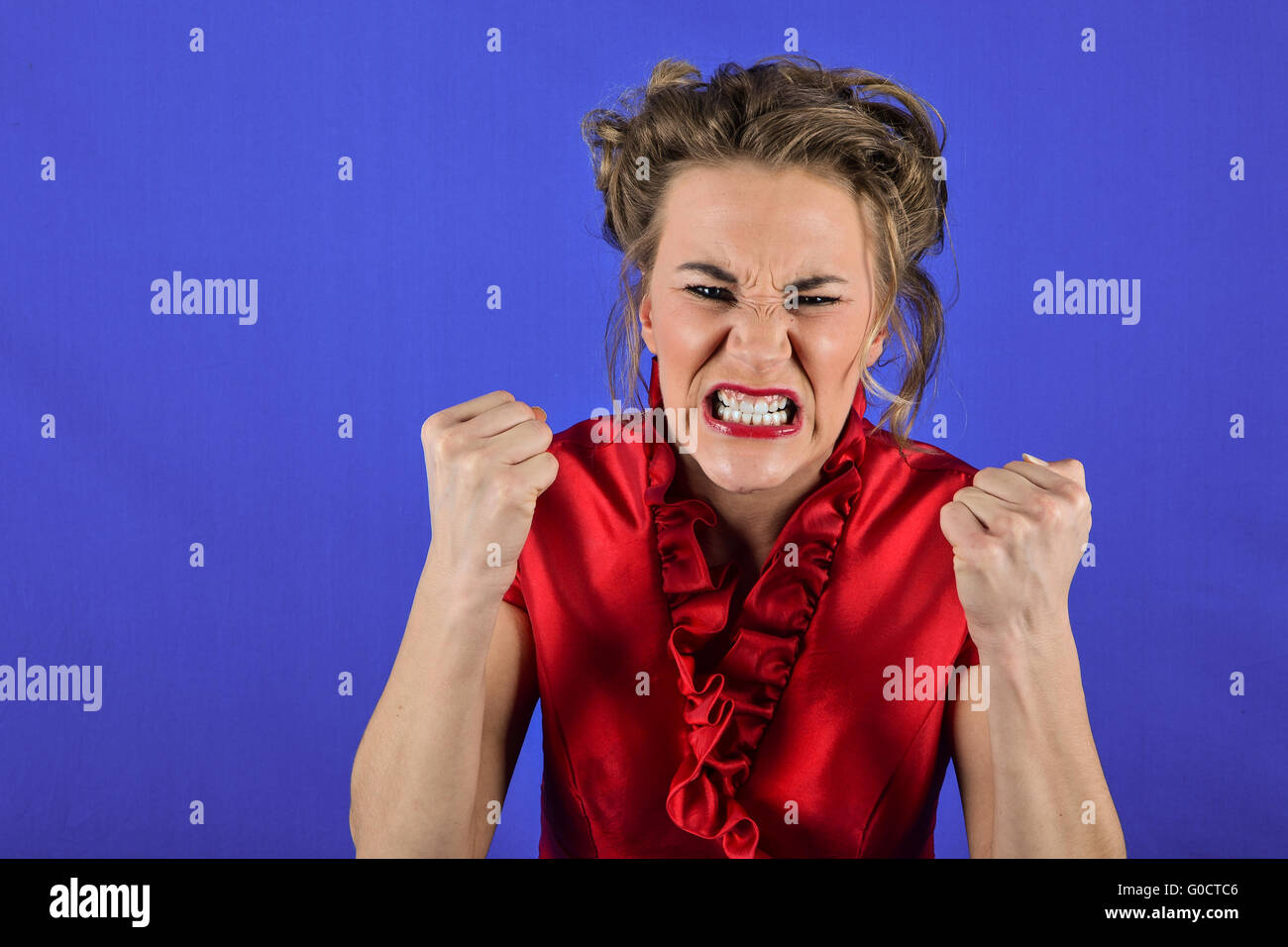 Blonde woman in anger Stock Photo - Alamy