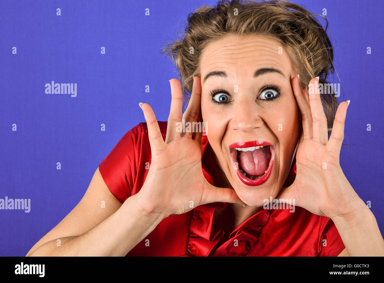 Woman against blue background Stock Photo - Alamy