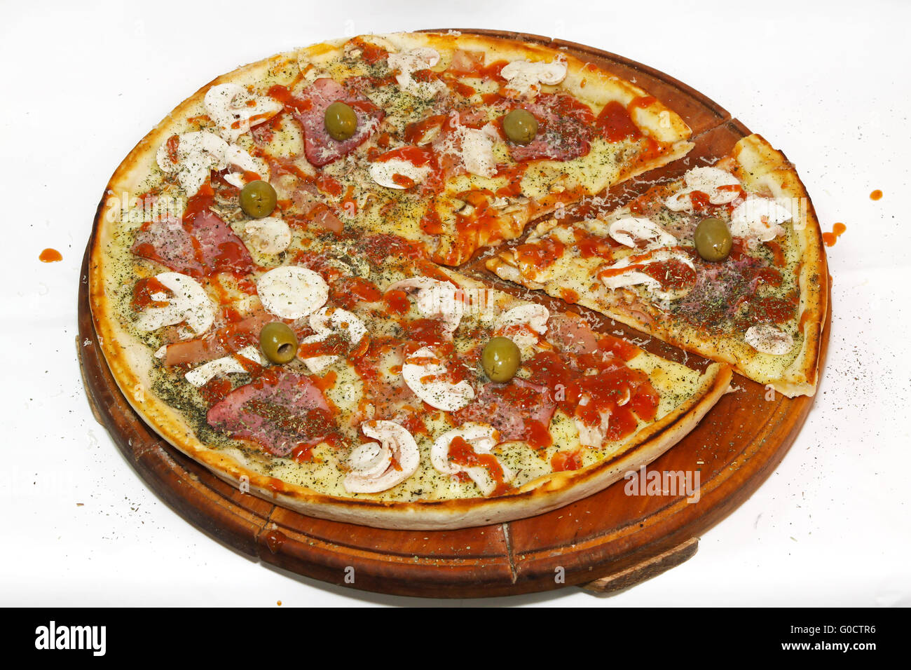 Traditional Italian style pizza with cutted slice Stock Photo - Alamy
