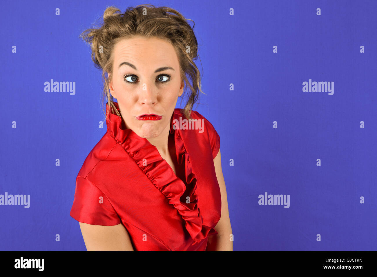 Woman against blue background Stock Photo - Alamy