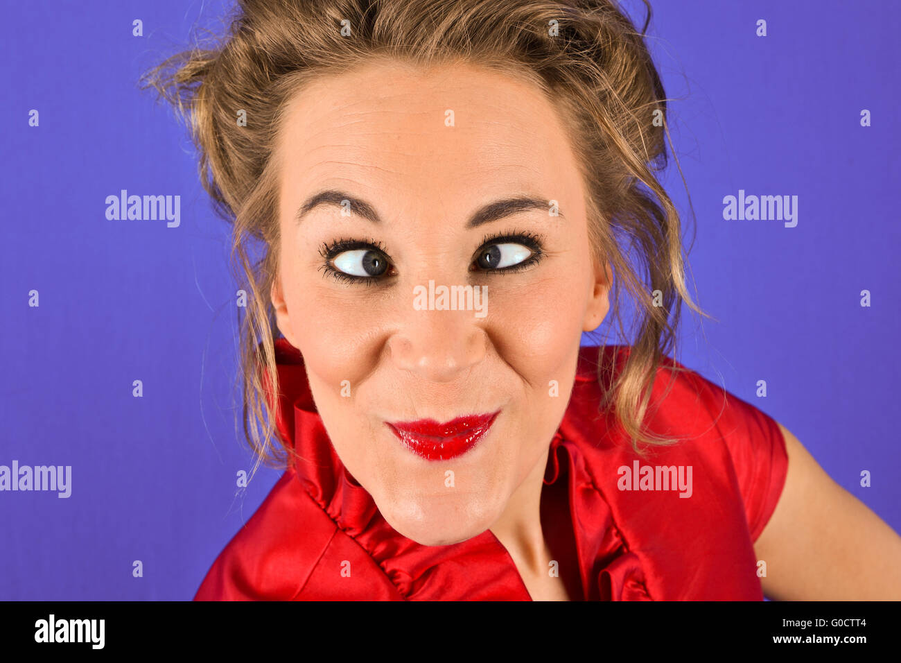 Woman against blue background Stock Photo - Alamy