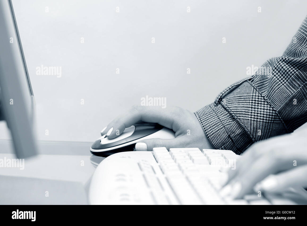 Female hands using computer mouse and keyboard Stock Photo - Alamy