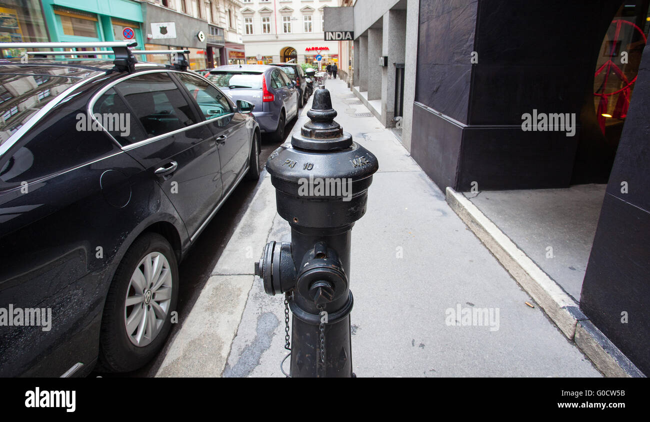 black fire hydrant in the center of the old town Stock Photo - Alamy