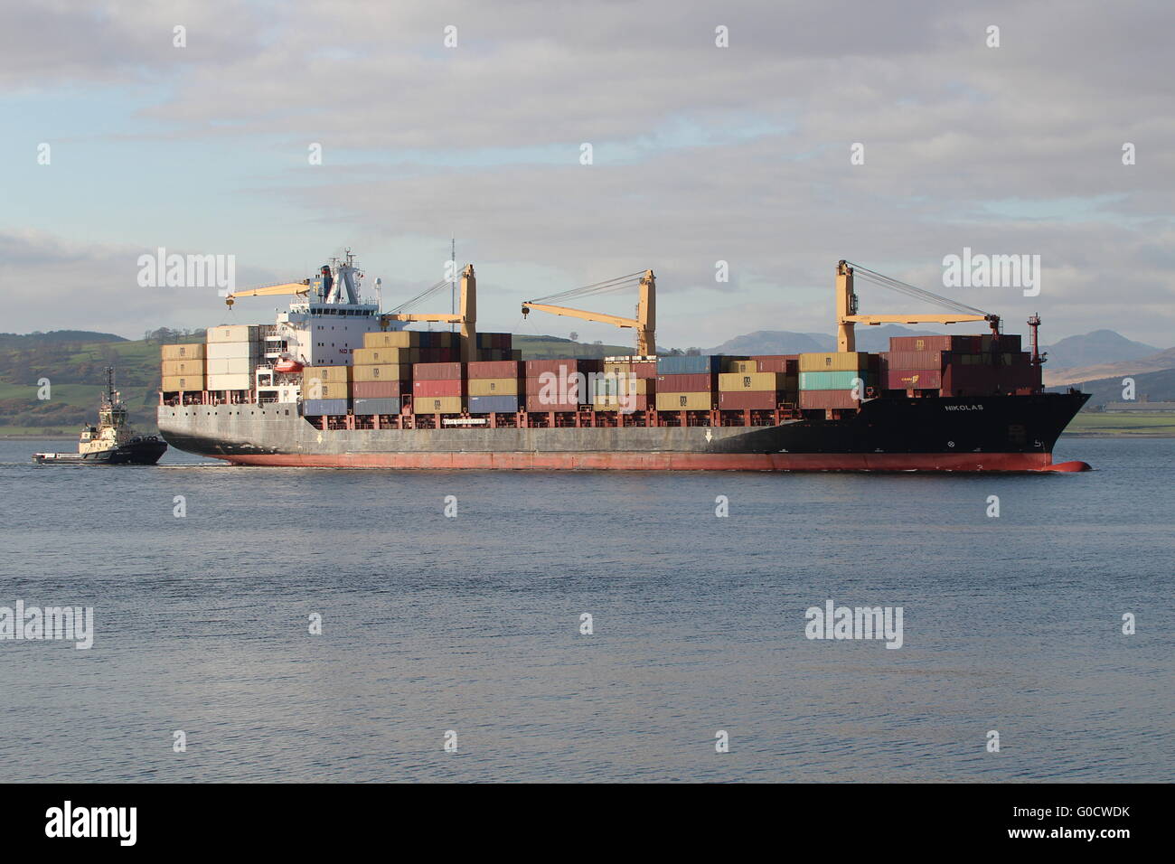 The container ship Nikolas, assisted by the Svitzer tug Ayton Cross ...