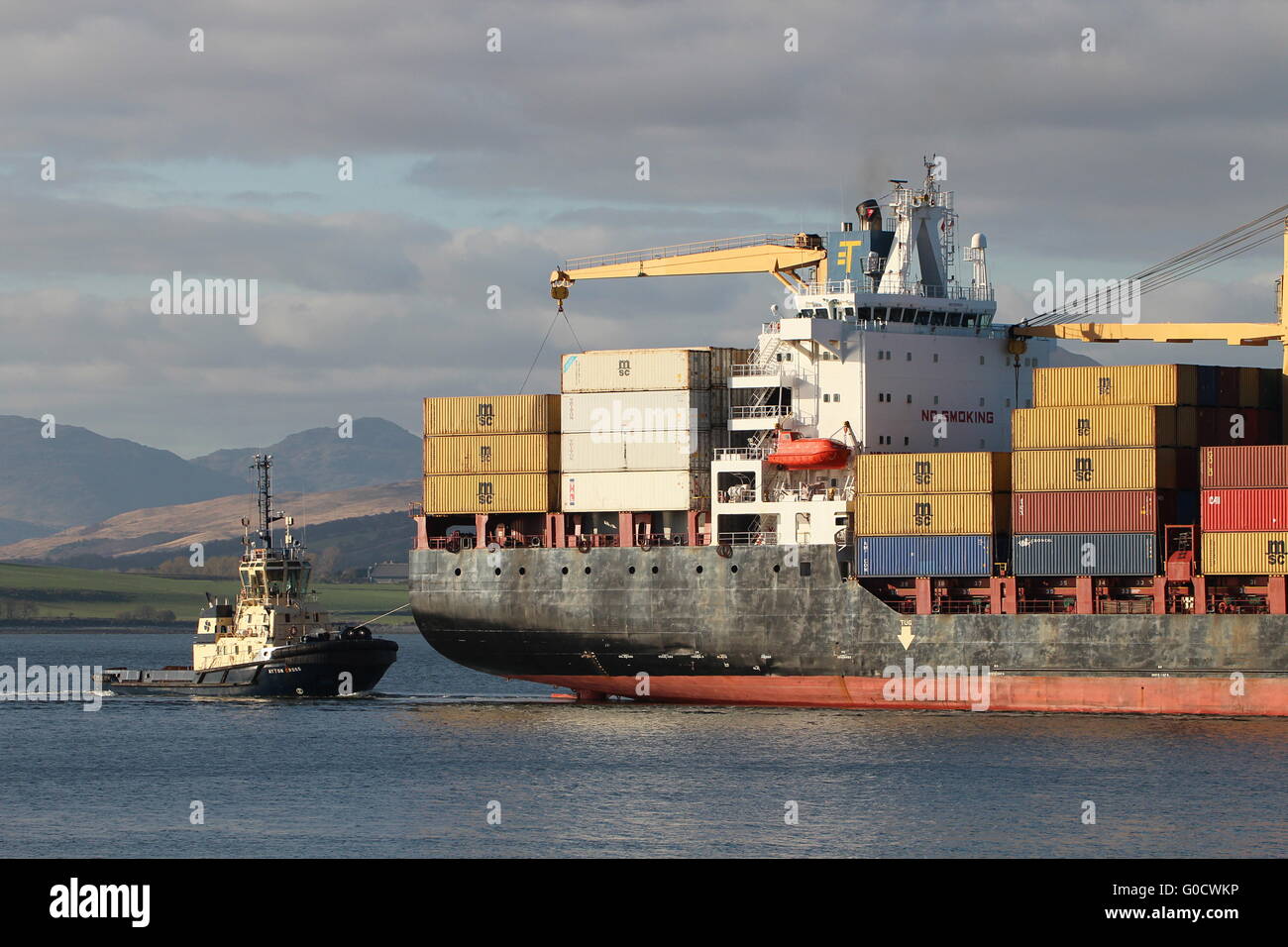 The container ship Nikolas, assisted by the Svitzer tug Ayton Cross ...