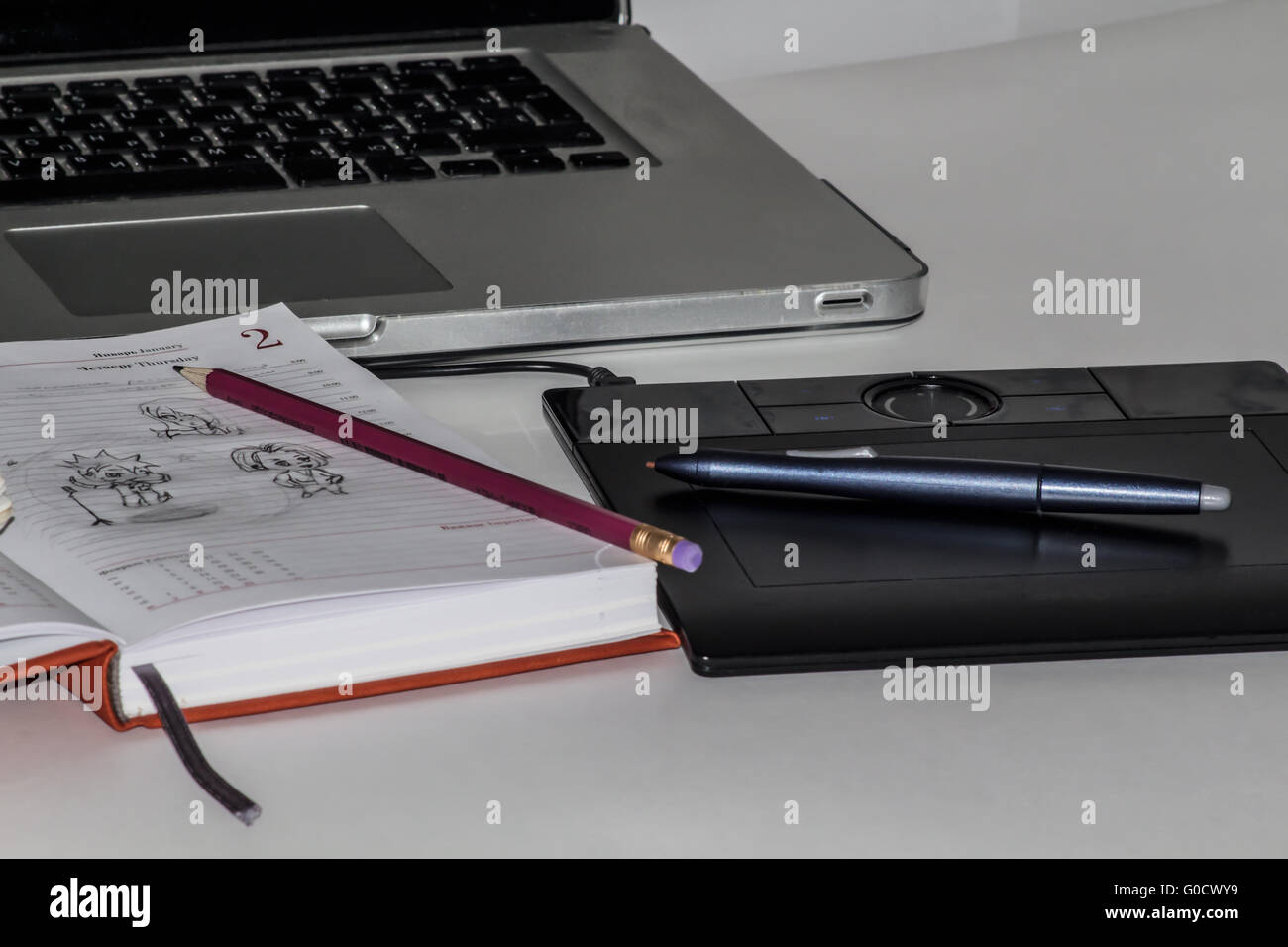 Laptop, daily log and pen Stock Photo - Alamy