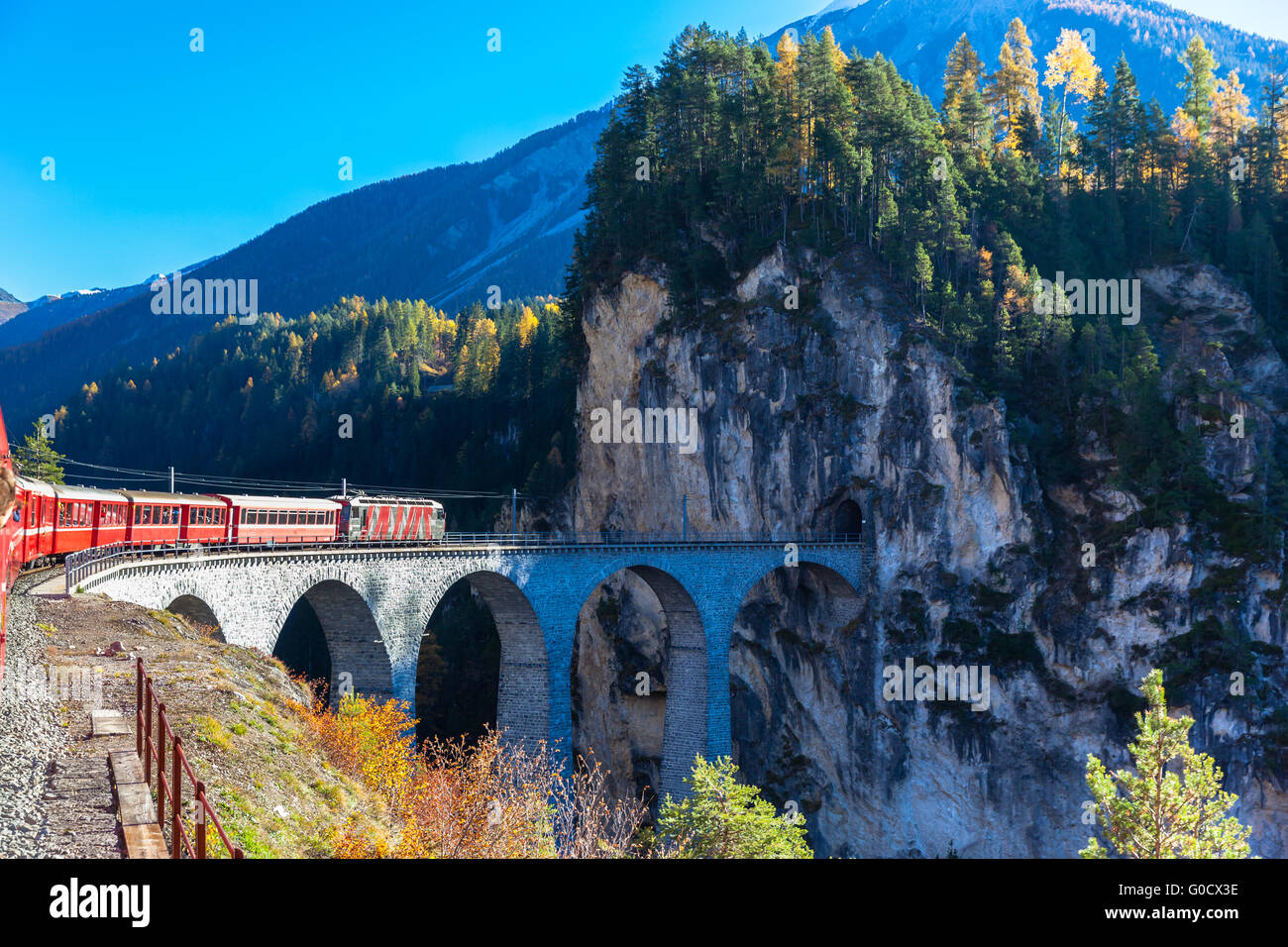 The train of Rhaetian Railway running on the famous Landwasser Viaduct ...