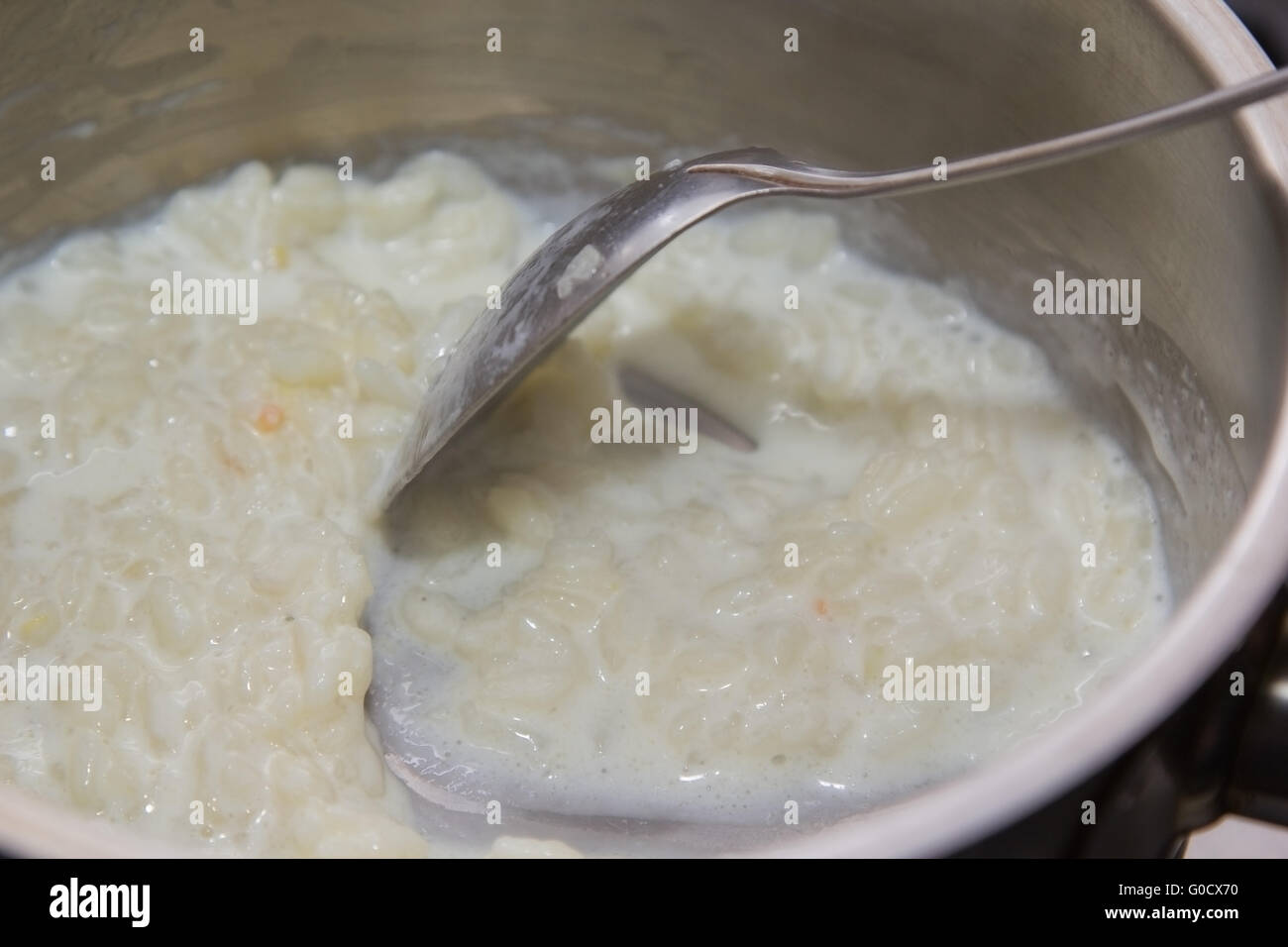 process risotto. Cooking on kitchen closeup Stock Photo - Alamy