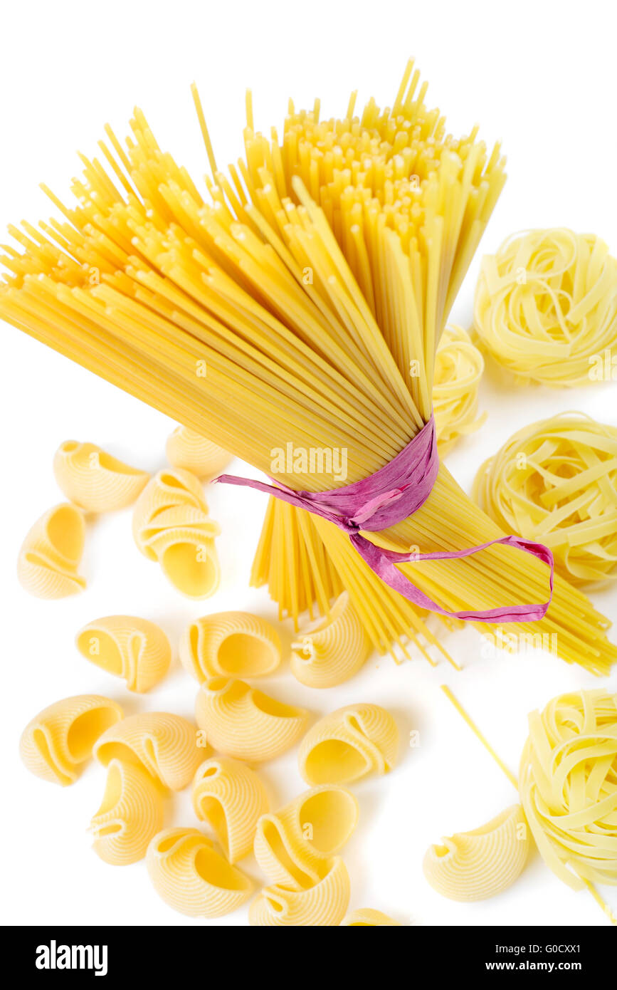 Mixed uncooked raw italian pasta with spaghetti Stock Photo - Alamy