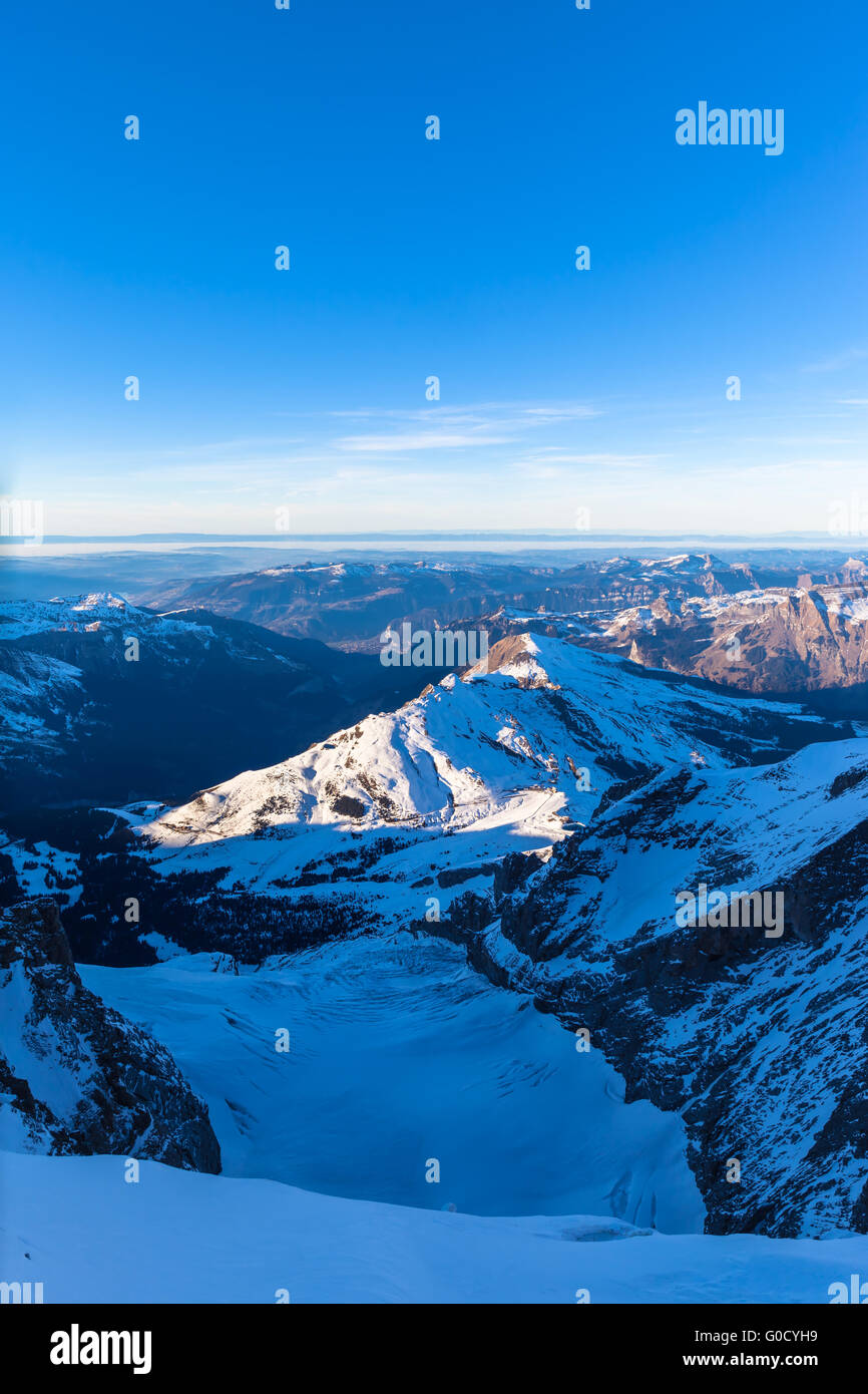 Stunning view of the mountain range of Bernese Alps at dusk from ...