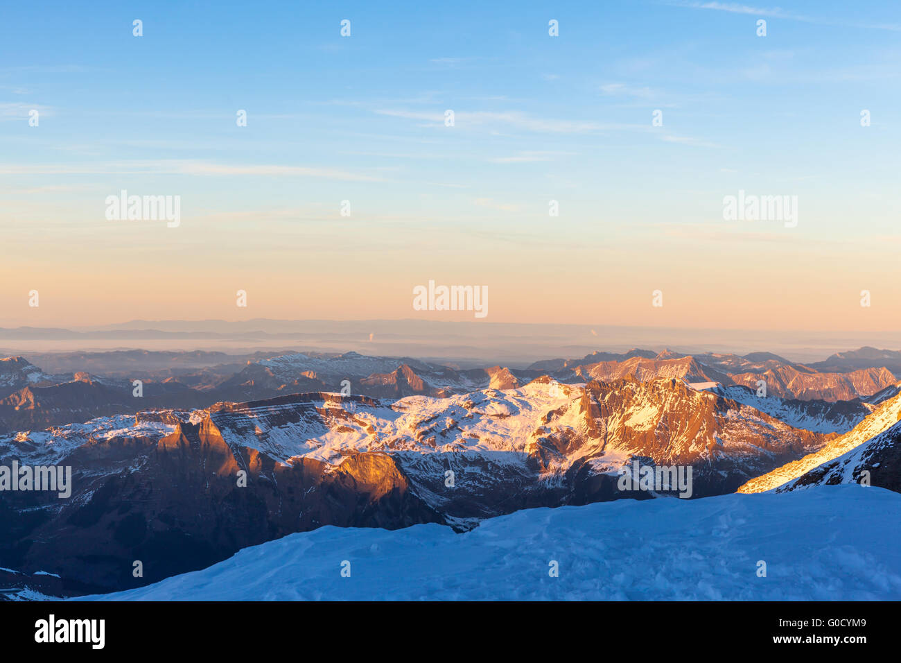 Panorama view of the mountain range of Bernese Alps at dusk from ...