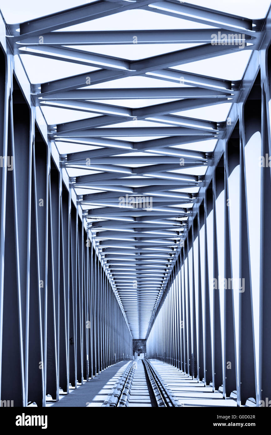 Railway metal bridge perspective view - blue tone Stock Photo - Alamy